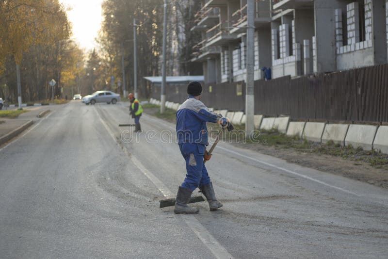 Road Cleaning. Workers are Cleaning the Highway Editorial Photo - Image ...