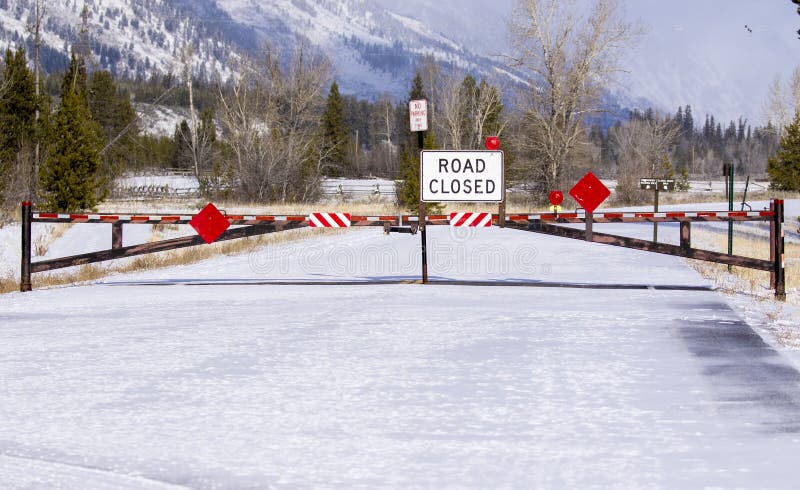Road Closed Sign And Gate Blocking Road Access During Winter Tim Stock ...