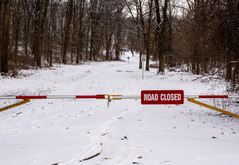 Road Closed Sign in Red and White with Closed Gate on Snowy Road Stock ...