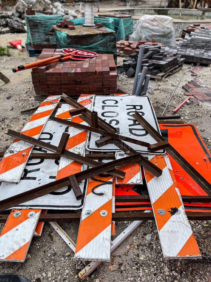 Road Closed Signs Sit among Supplies at Construction Site Stock Photo ...