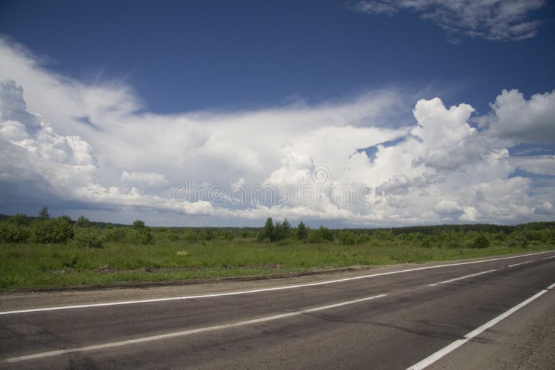 On road with clouds stock photo. Image of scenery, countryside - 5638538