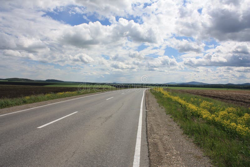 On the road with clouds stock image. Image of away, clouds - 114956807