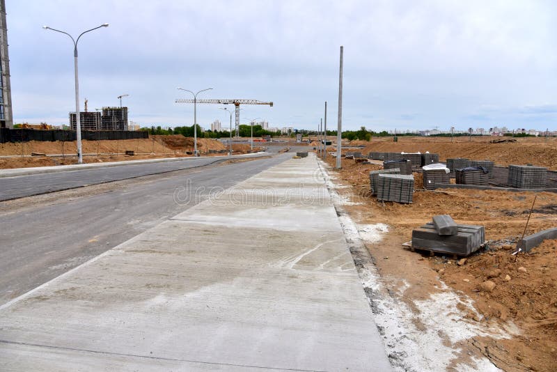Road Concreting at Construction Site. Concrete Pavement. Construction ...