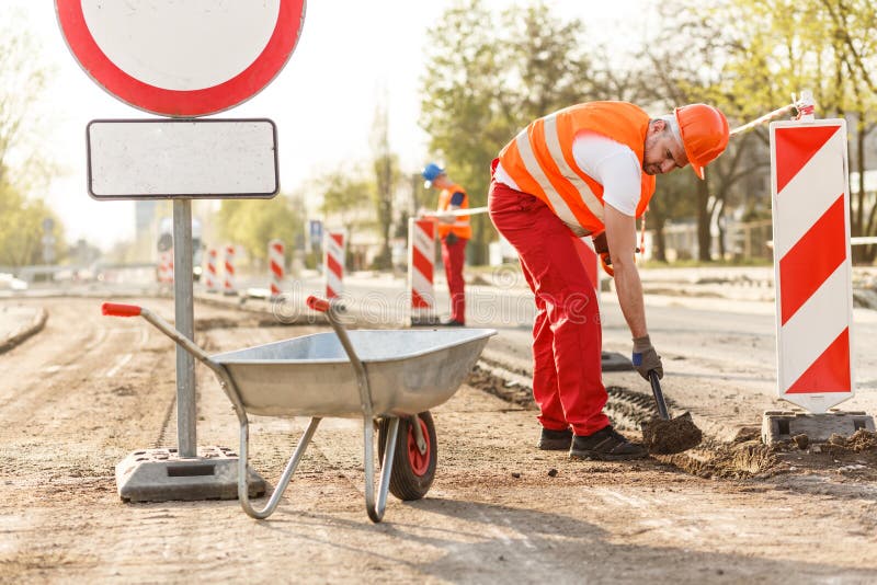 Road Construction Contractor Stock Photo - Image of wheelbarrow, street ...