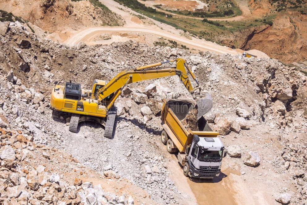Road Construction Machines in the Mountains. Mountain Road. Road ...