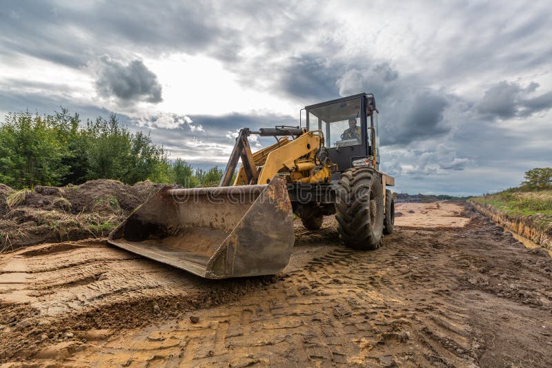 Road Construction and One of the Construction Machinery - Bulldozer is ...