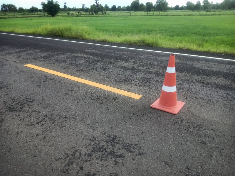 Road Construction with a Red Rubber Cone in Front Stock Image - Image ...