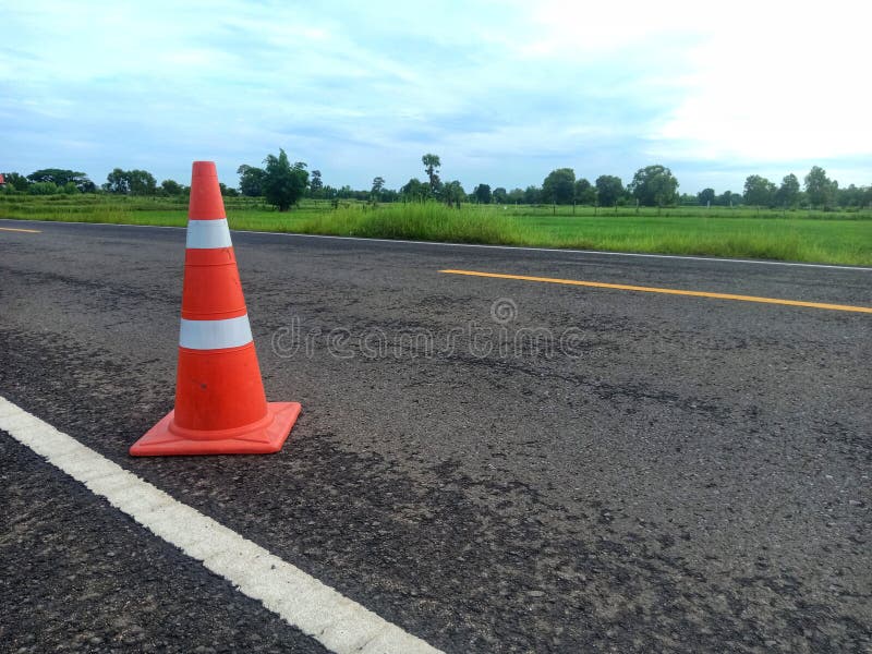 Road Construction with a Red Rubber Cone in Front Stock Photo - Image ...