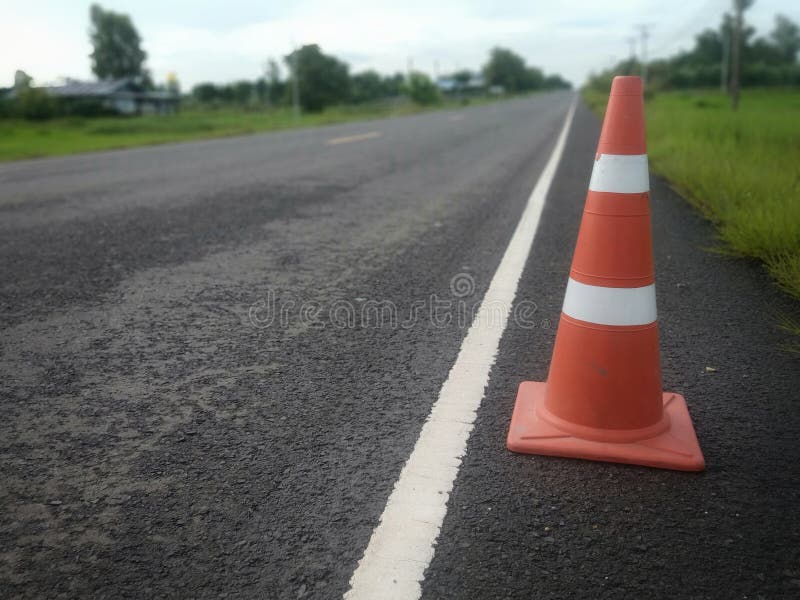 Road Construction with a Red Rubber Cone in Front Stock Photo - Image ...