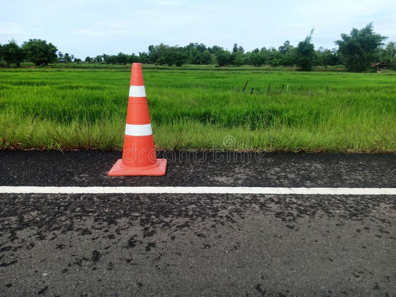 Road Construction With A Red Rubber Cone In Front Stock Photo - Image ...
