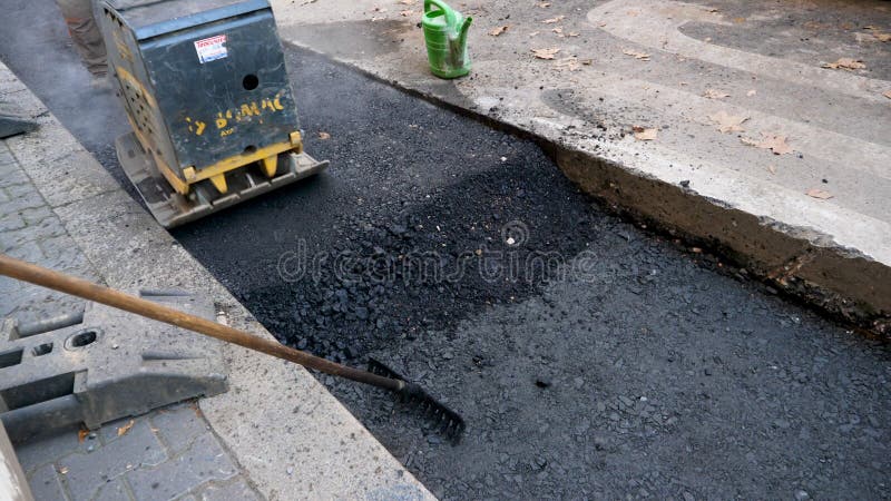 Road Construction Site - Filling the Asphalt. High Angle View Stock ...