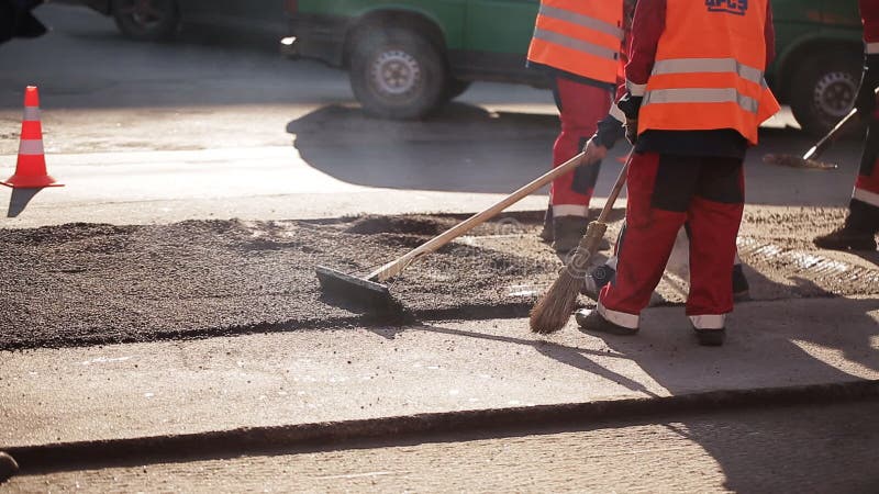 A Worker Leveling PCC Foundation Concrete Slab on a New Building ...