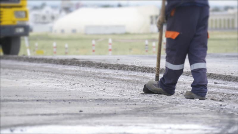 Road Construction Worker Leveling Asphalt Using Rake Stock Video ...