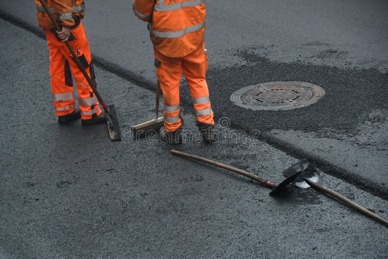 Road Construction Workers Working with Sweeping Brush Stock Photo ...