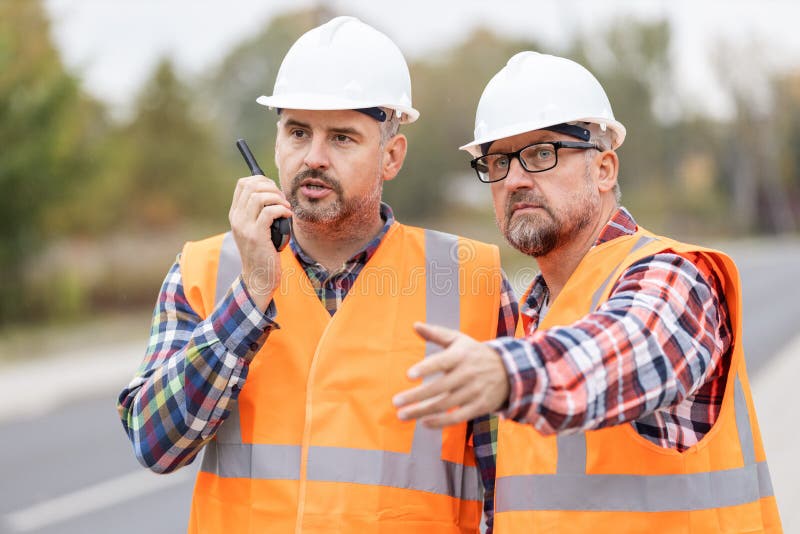 Construction Workers Talking To Walkie-talkie Stock Image - Image of ...