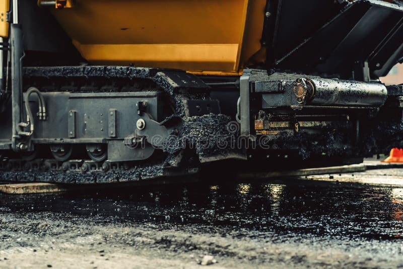Asphalt laying machines stock photo. Image of concrete - 121672970