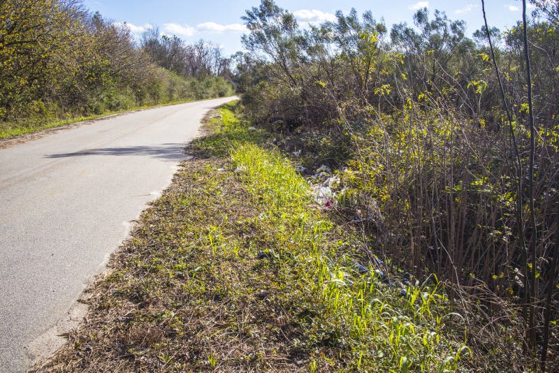 A Road in the Country with Trash on the Side of the Road Stock Image ...