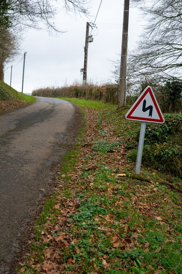 Road in the Countryside and a Sign of Several Turns. Warning Sign for ...