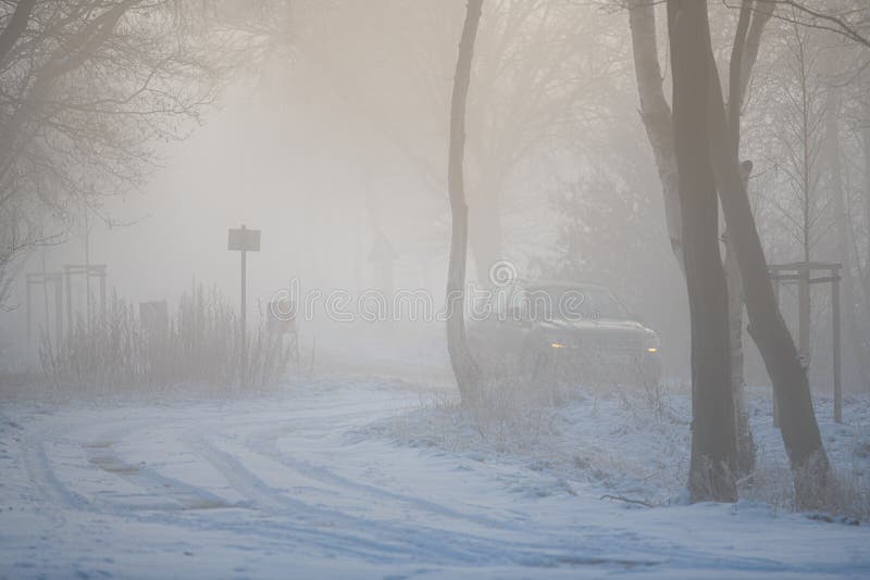 A Road Curve in the Fog while the World is Sunk in the Snow Stock Image ...