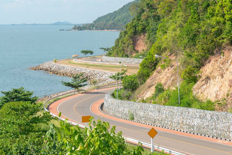 Road curved on coastline stock photo. Image of picturesque - 196096908