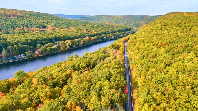 Road Cutting through Early Fall Forest Along Delaware River from Drone ...