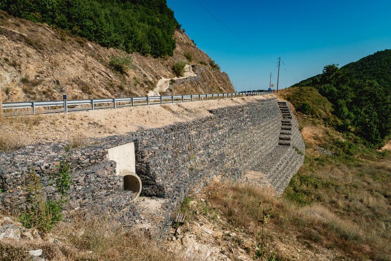 Road through the Dam on a Sunny Day Stock Photo - Image of architecture ...