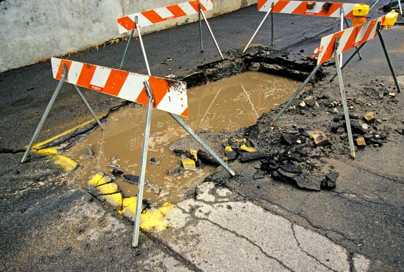 Road Damage from Water Underground Water Main Pipe Break Stock Image ...