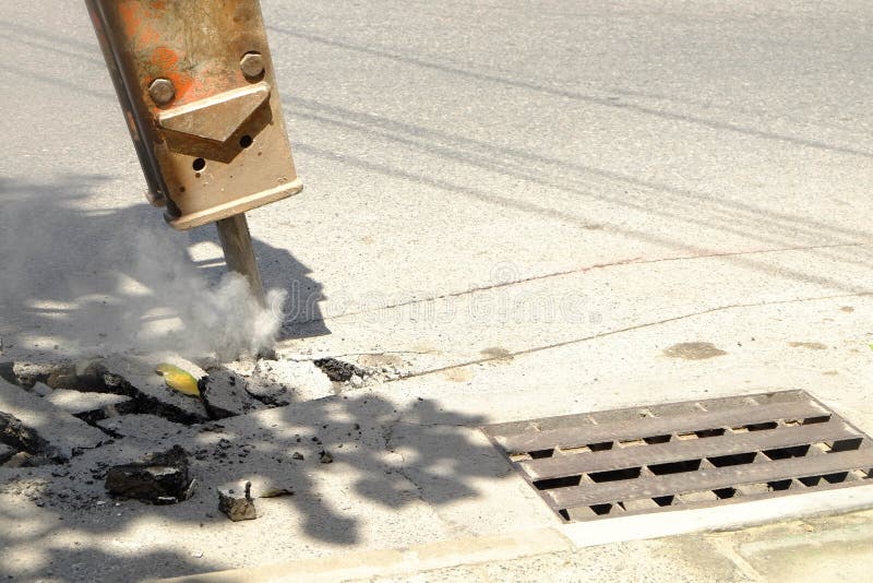 The Road Drilling Machine are Digging Road Surface. Stock Image - Image ...