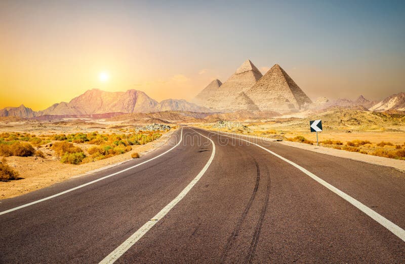 Road in Egypt and pyramids stock photo. Image of road - 296145328
