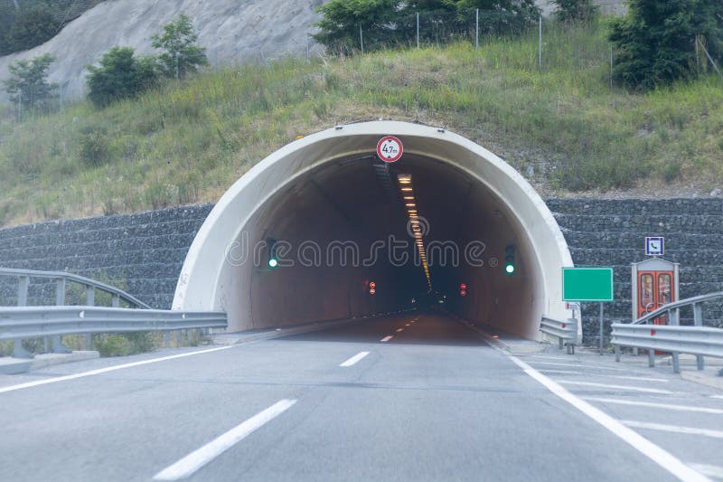 Road Entering a Tunnel with Light Inside Stock Image - Image of empty ...