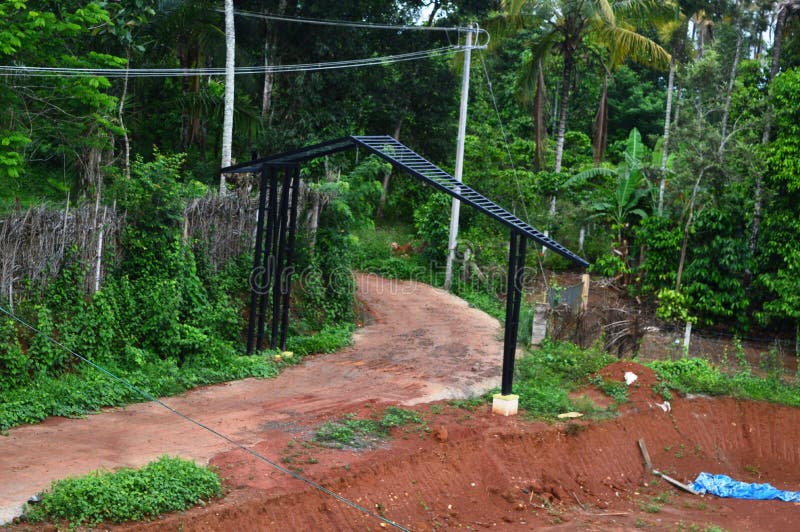 Road and the entrance gate stock image. Image of gate - 186321225