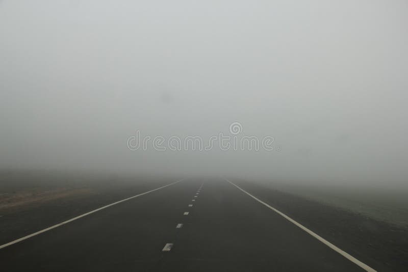 Road Extending To the Thick White Mist Stock Photo - Image of foggy ...