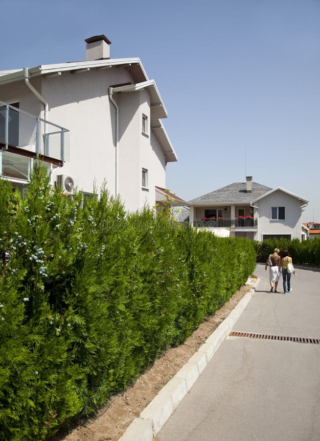 Road between family houses stock image. Image of estate - 10461081