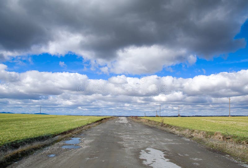 Road in field stock photo. Image of spring, meadow, dirt - 214163998