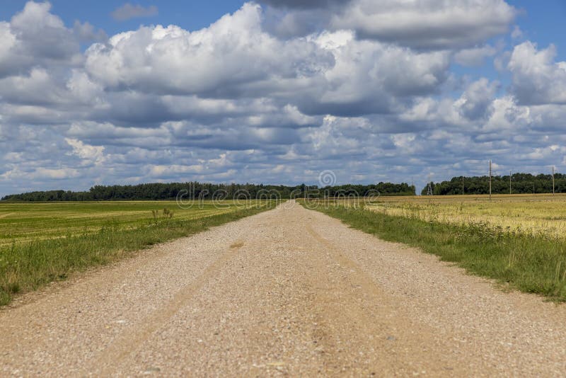 A Road through a Field with Poor Infrastructure Stock Image - Image of ...