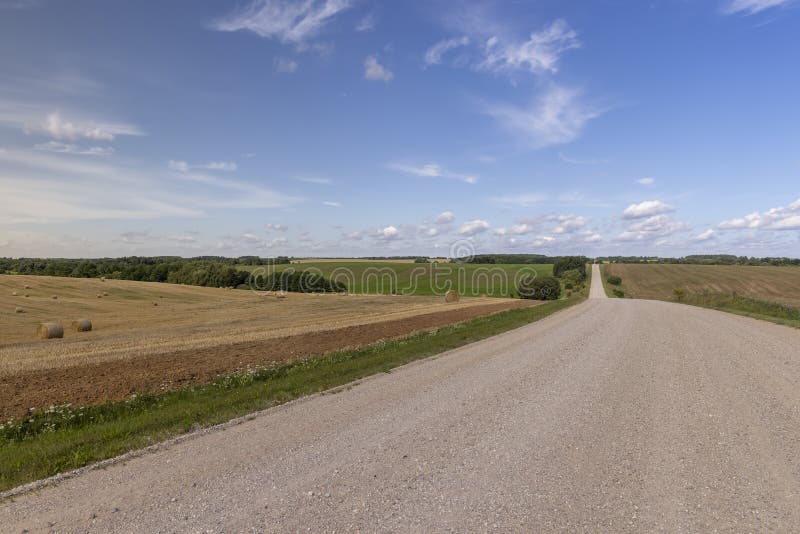 A Road through a Field with Poor Infrastructure Stock Photo - Image of ...