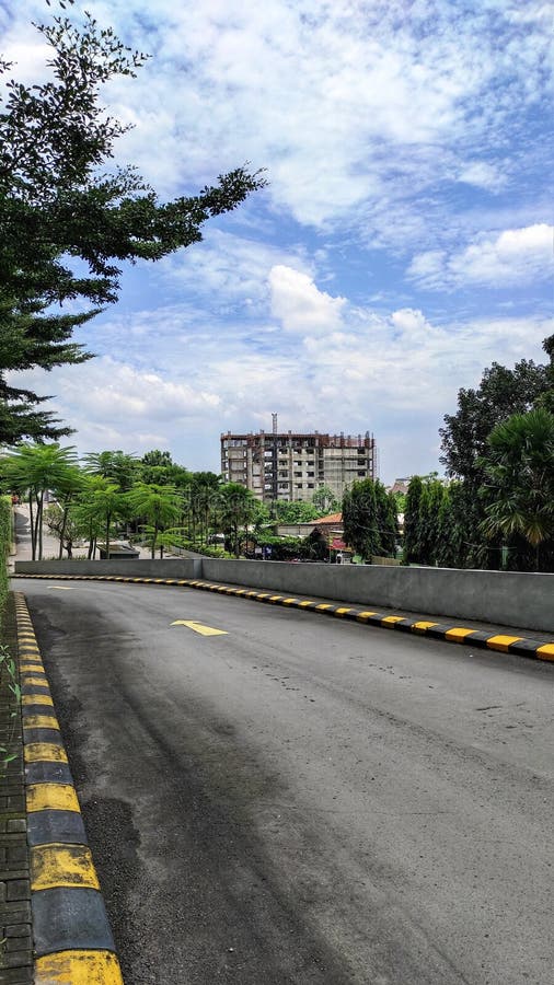 A Road in Front of Building and Cloudy Sky Editorial Photography ...