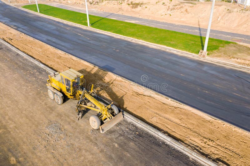 Road Grader on Road Construction Site. Aerial View Stock Photo - Image ...