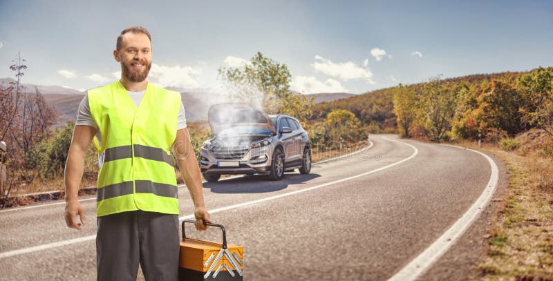 Road Help Worker Holding a Tool Box and Smiling on the Road Stock Image ...