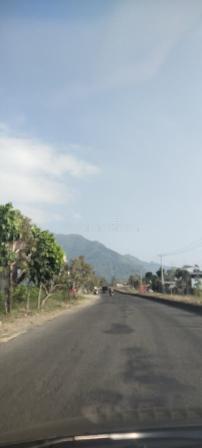 Road with hill view stock image. Image of vehicle, terrain - 228468801