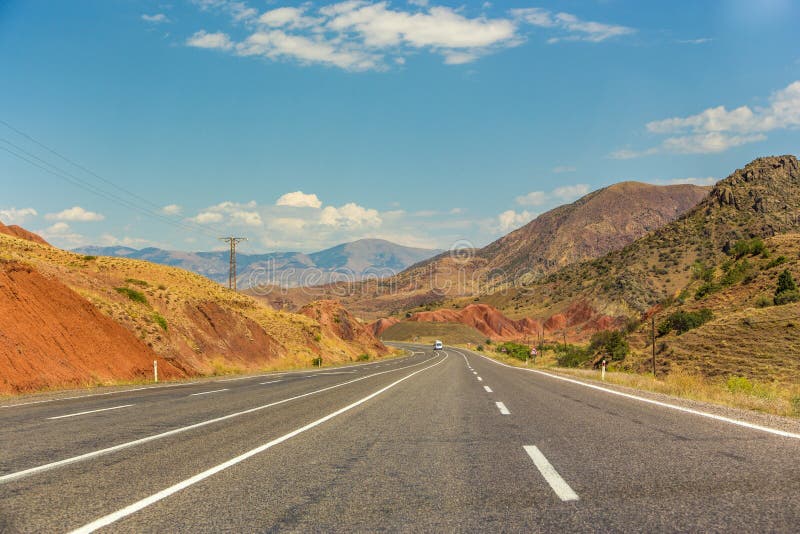 Road through hills stock image. Image of grass, plains - 180329179