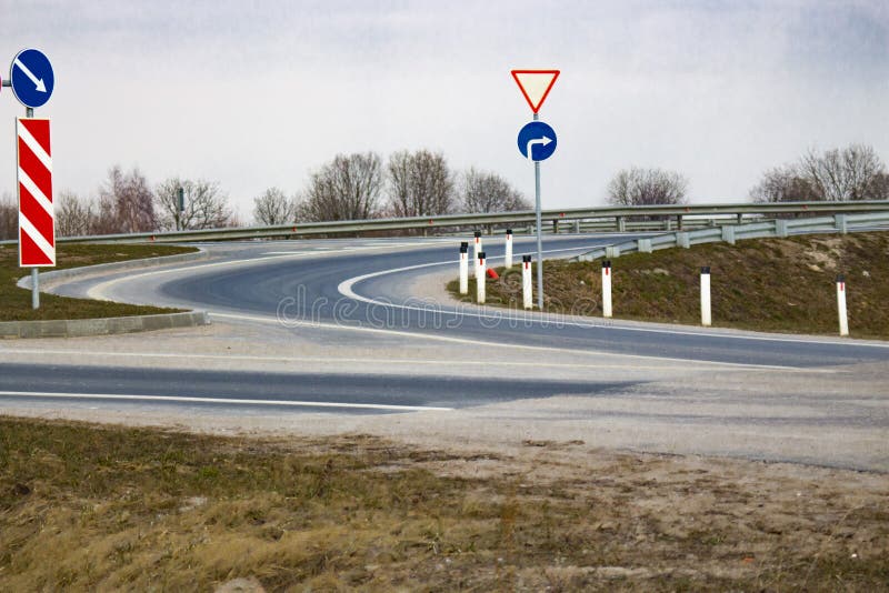 Road Junction with Turn and Road Signs Stock Image - Image of traffic ...