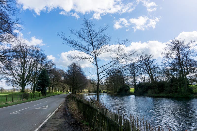 A Road and a Lake Side by Side Stock Photo - Image of outdoors, scene ...