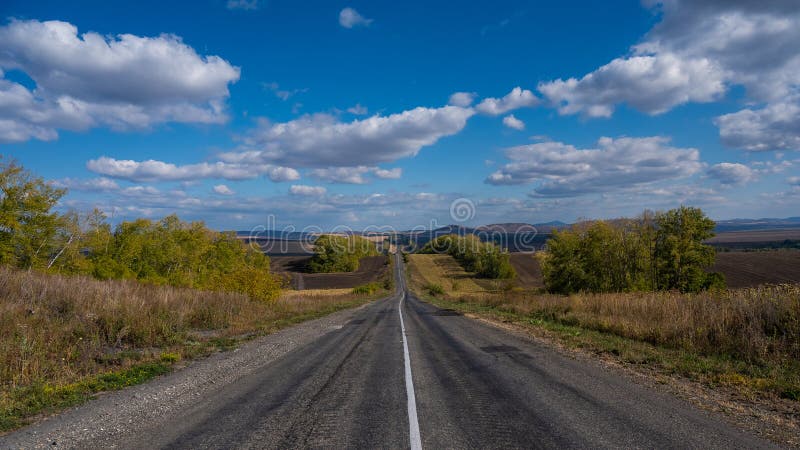 Road Landscape. Empty Track among Mountains and Fields in Autumn. Stock ...