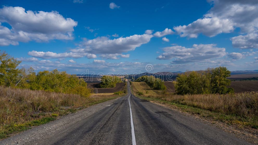 Road Landscape. Empty Track among Mountains and Fields in Autumn. Stock ...