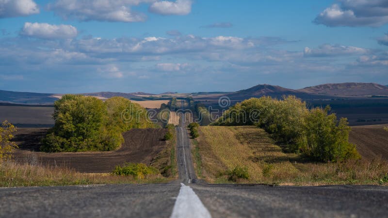 Road Landscape. Empty Track among Mountains and Fields in Autumn. Stock ...