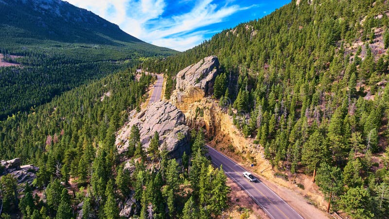 Road through Large Boulder in the Mountains of Pine Trees Stock Photo ...