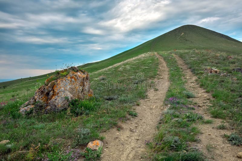 The Road Leading To the Top of the Mountain. Overcast Weather Stock ...