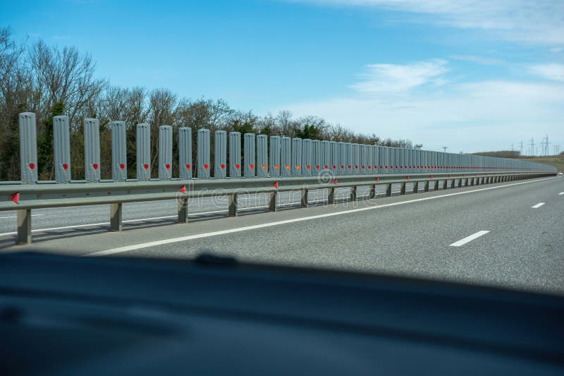 A Road with a Long Line of Metal Posts with Red Hearts on Them. the ...