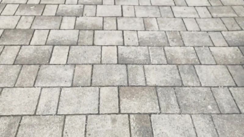 The Road is Made of Grey Stone Bricks. Concrete Blocks Pavement. Gray ...